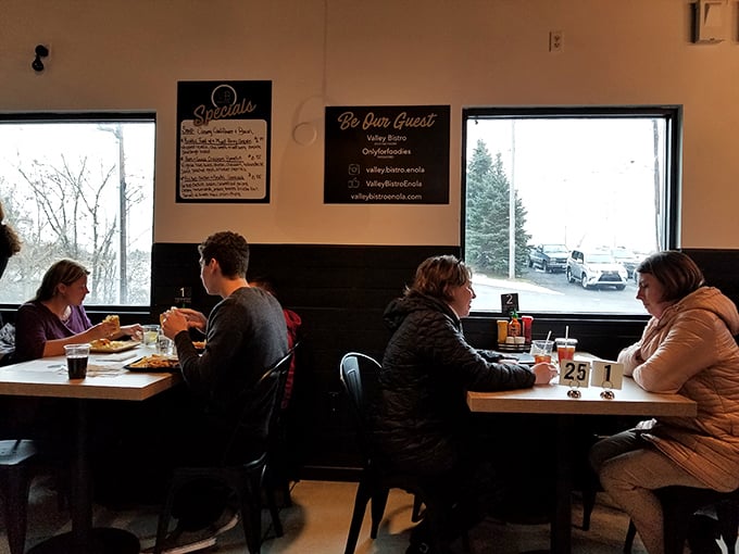 The universal language of good food brings people together—these diners aren't just eating, they're creating memories.