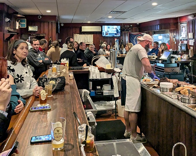 The bustling bar area—where strangers become friends over shared appreciation of cold beer and hot food. A community gathering spot in its purest form.