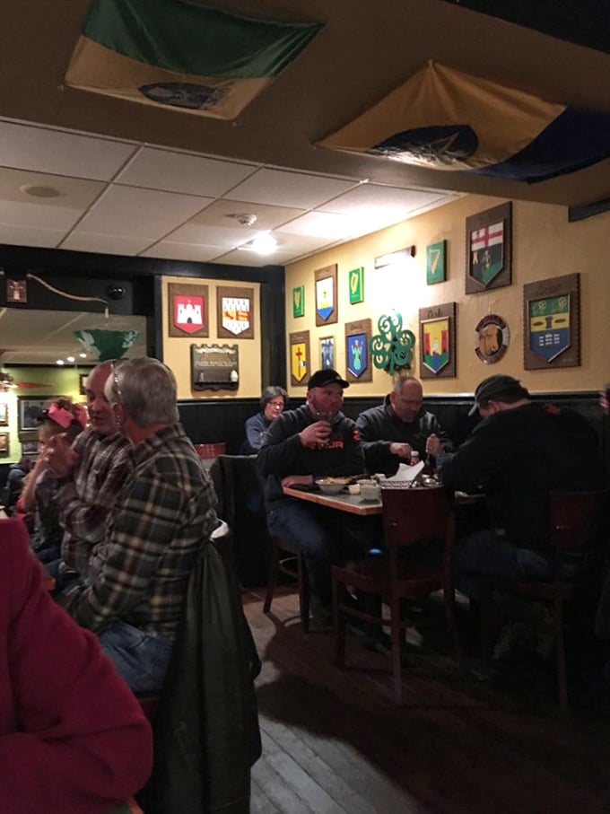 Local diners gather around tables sharing stories and exceptional food in this beloved neighborhood gathering spot.