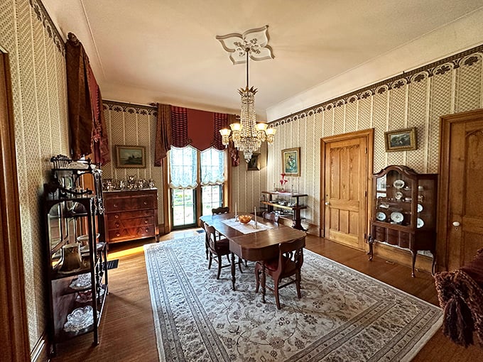 The Victorian dining room stands ready for guests who'll never arrive, a stage set for elaborate meals where conversation was the main course.