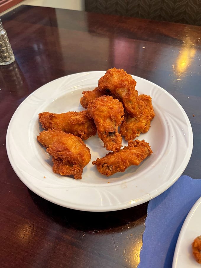 Fried chicken wings with the perfect crunch-to-juiciness ratio—the kind that make you wonder why you ever bothered with those chain restaurants.