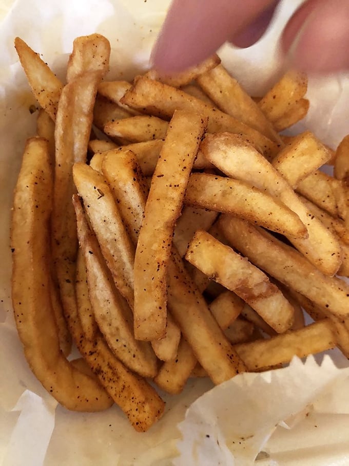 These aren't just fries – they're golden vessels for whatever heavenly sauce you choose to baptize them in.