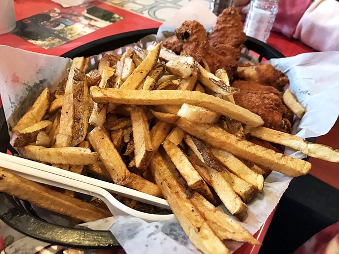 Hand-cut fries alongside golden-fried chicken—simple pleasures elevated to art form, proving sometimes the classics need no improvement.