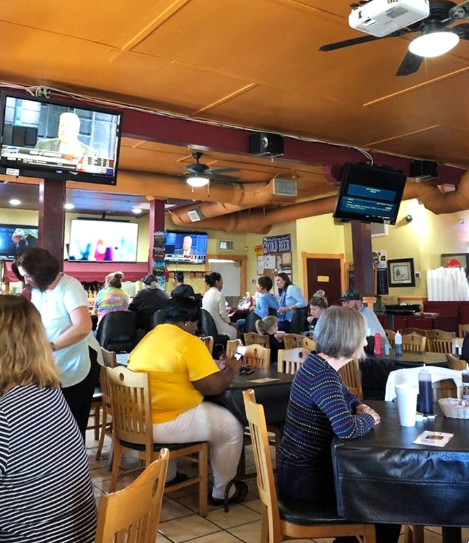 The bustling dining room hums with the symphony of forks against plates and genuine conversation. No Instagram posing here—just people actually enjoying their food.