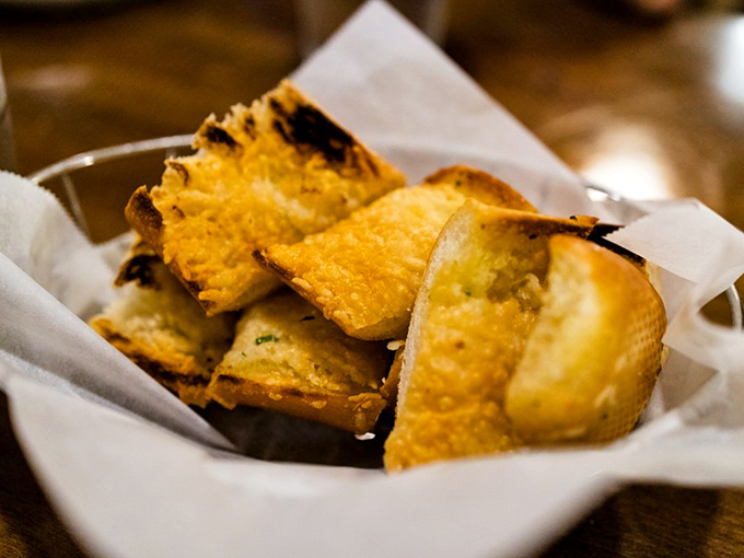Garlic bread that's achieved the perfect golden ratio—crisp enough to crackle, soft enough to soak up every last drop of chowder.