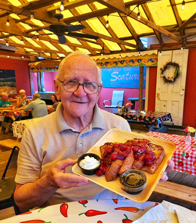 The universal language of "this food is amazing" needs no translation—just the smile of someone experiencing Door County's cherry-topped French toast for the first time.