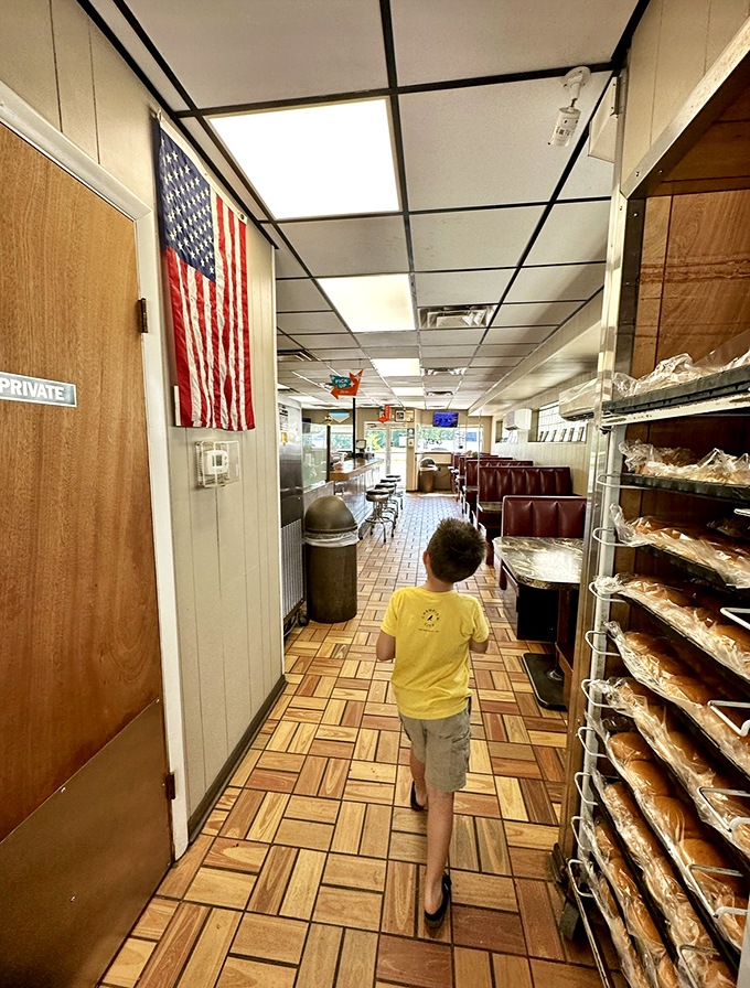 An American flag watches over the proceedings, as if to certify this place as officially part of our national culinary heritage.