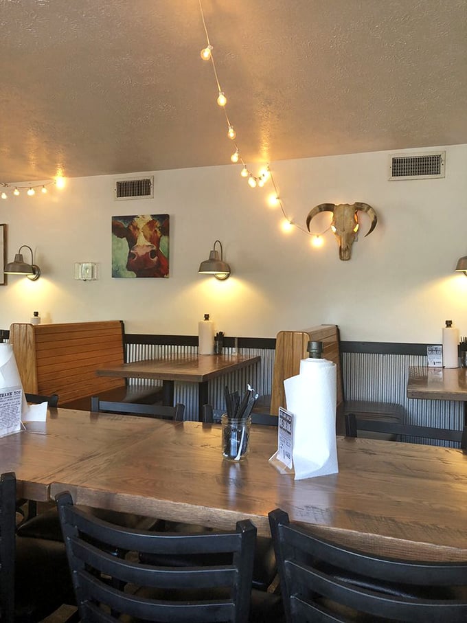 String lights overhead and warm wood tones create that "one more bite" atmosphere where lunch easily stretches into dinner conversations.