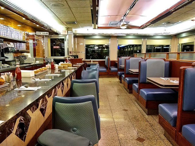 The interior reveals the diner's beating heart—comfortable booths where memories are made three meals a day, seven days a week.