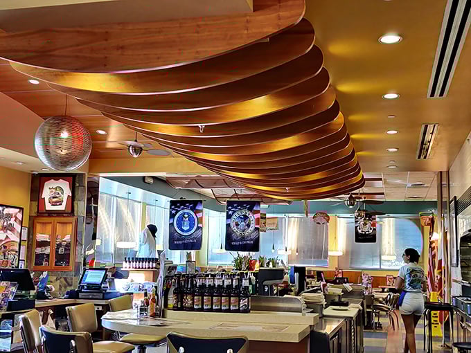 The curved wooden ceiling beams aren't just architectural details—they're the ribs of this culinary cathedral where comfort food is the religion.