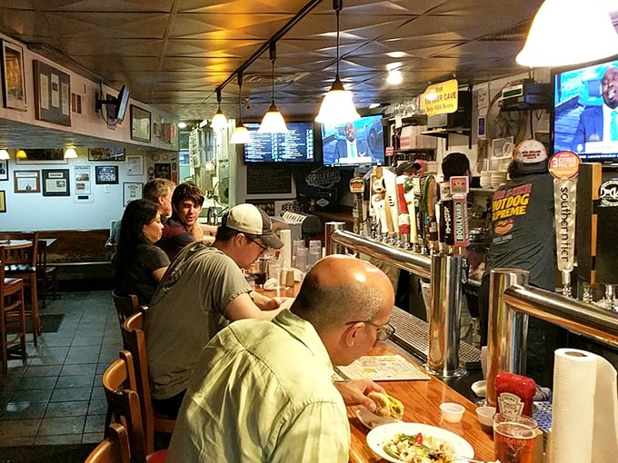 The bar area—where strangers become friends and friends become family. Those beer taps are like wands, dispensing liquid happiness one pint at a time.