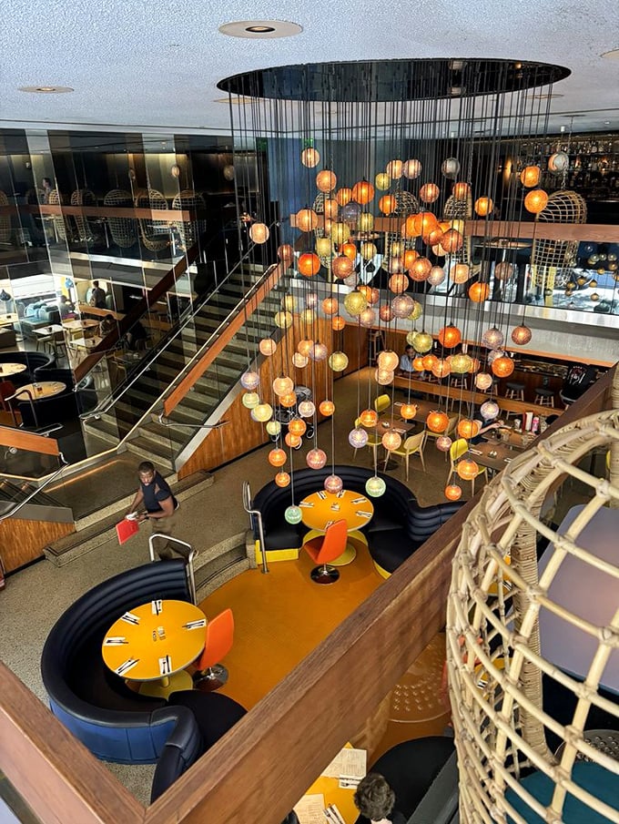Looking down from above reveals the restaurant's genius design – a multi-level playground for grown-ups with those signature curved booths and vibrant colors.