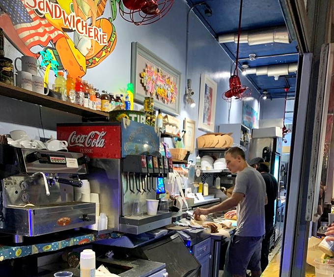 The sandwich assembly line—where speed meets craftsmanship. Like watching Michelangelo paint the Sistine Chapel, if Michelangelo worked with baguettes instead of brushes.