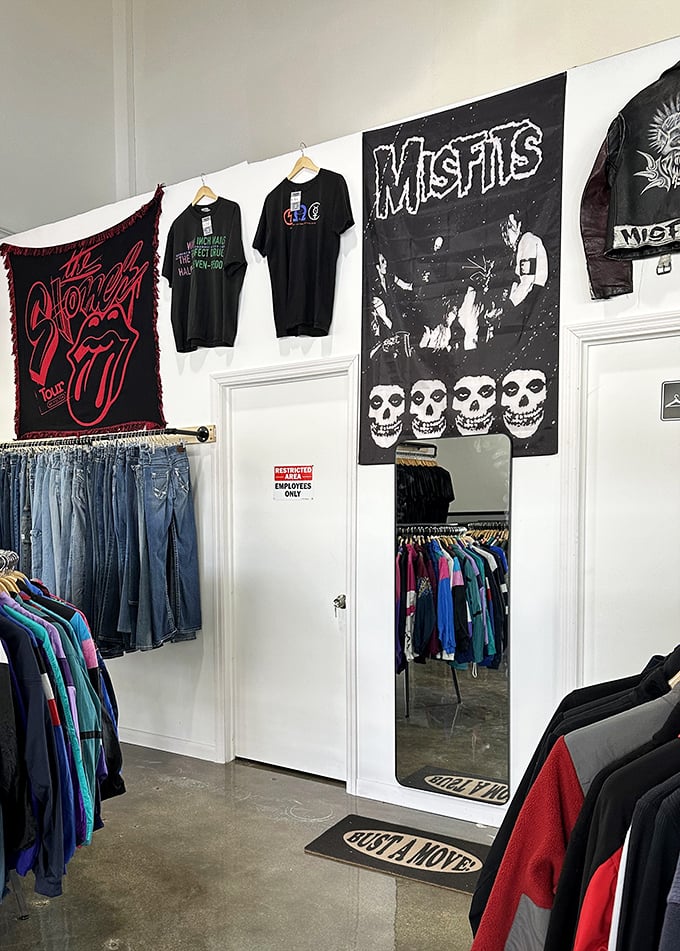 "Just a Move" indeed – this fitting room entrance flanked by band flags invites you to try on your potential new identity.