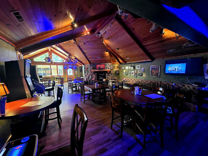 Rustic charm meets evening ambiance. Those wooden cathedral ceilings make every meal feel like a special occasion, even if it's just Tuesday.