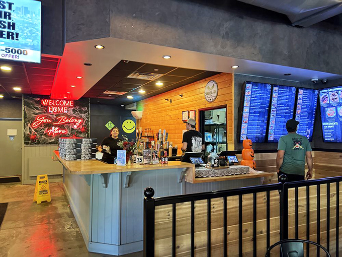 The ordering counter where BBQ dreams begin, complete with the neon promise that "You Belong Here"—and your stomach certainly agrees.