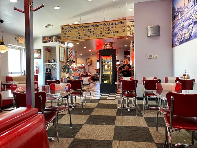 Red chairs, checkered floors, and display cases full of temptation—the diner aesthetic that never goes out of style.