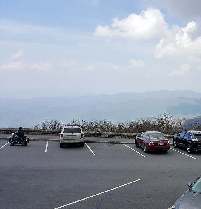 The humble parking area—where adventures begin and car thermometers remind you that mountain air is indeed several degrees cooler.