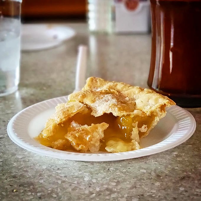This peach pie doesn't just whisper summer – it belts it out like Aretha Franklin. The glistening filling practically sings through the flaky crust.