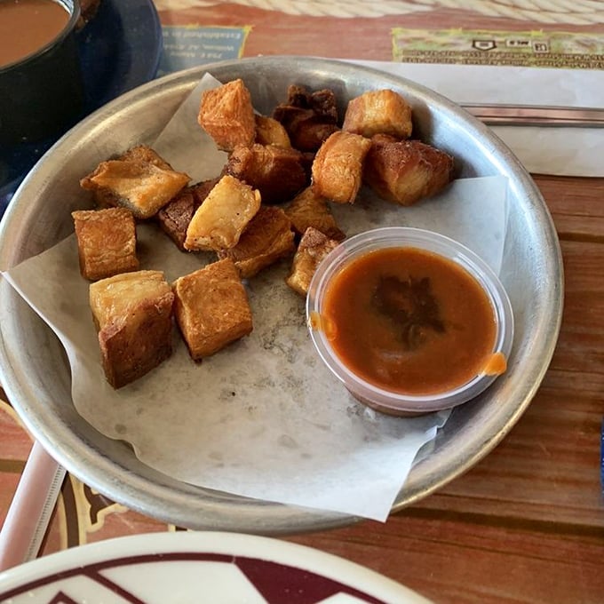 Pork belly bites – the candy of the meat world. These golden-brown cubes of happiness come with sauce, but honestly, they're perfect just as they are.
