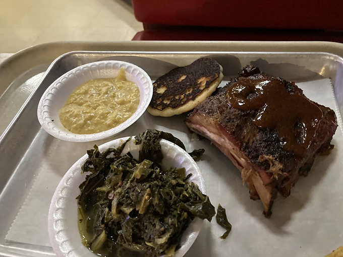 Ribs that don't just fall off the bone—they practically leap into your mouth, accompanied by greens that have been simmering since sunrise.