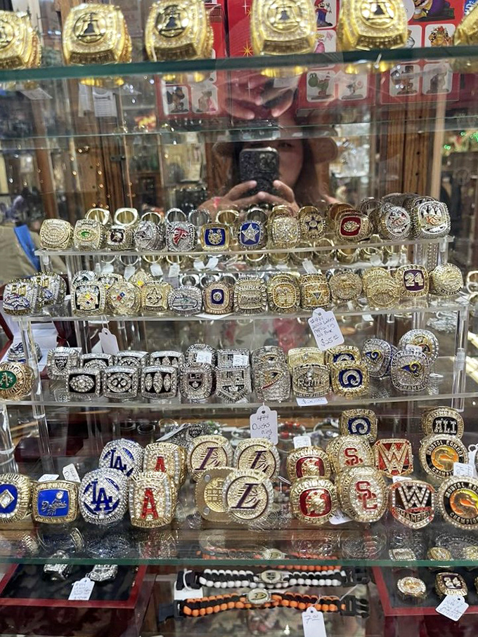 Championship dreams captured in gold and gemstones – each ring a frozen moment of athletic glory waiting for its next admirer.