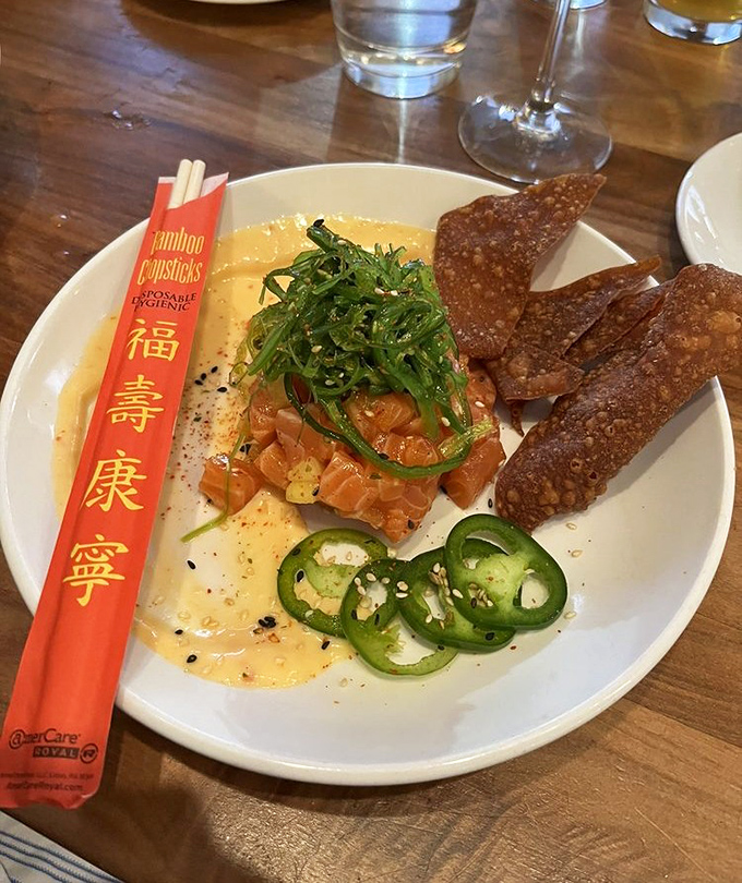 This salmon poke is having a moment with jalapeños, sesame crackers, and a sauce that makes everything play nicely together.