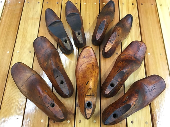 These wooden shoe forms aren't just practical—they're sculptural. Arranged like this, they transform from cobbler's tools into functional art.