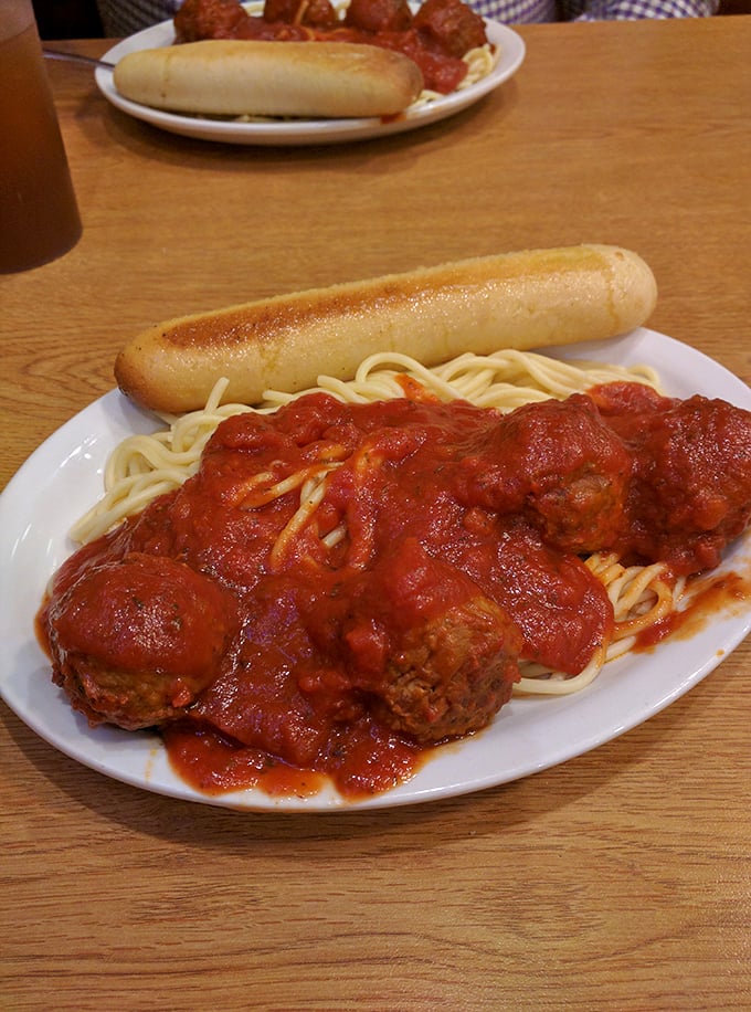 Spaghetti and meatballs with a side of garlic bread—proof that Italian-American classics taste best in unpretentious diners with paper napkins.
