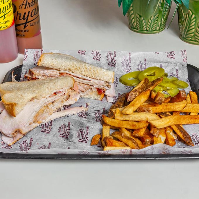 A turkey sandwich that defies expectations—proof that even poultry gets the royal treatment in this kingdom of smoke and fire. 