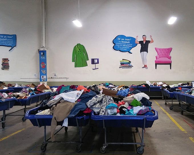 The walls literally talk about Goodwill's mission while shoppers focus on mining through mountains of potential wardrobe revolutions.