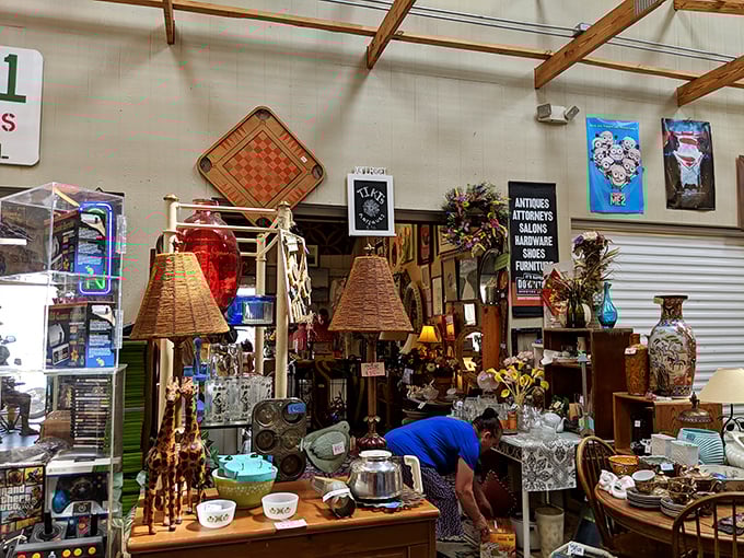 Lampshades and treasures and chairs, oh my! This antique corner feels like rummaging through your coolest grandparent's attic—but everything's for sale.