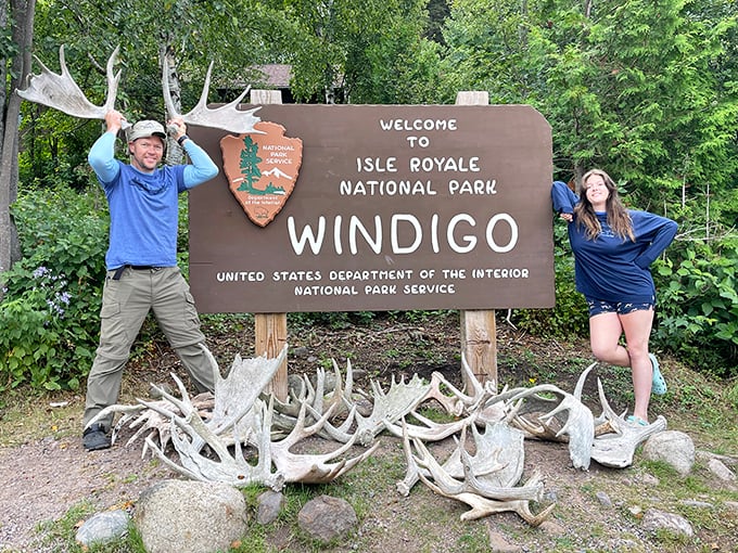 Finding joy in the wild places. The collection of moose antlers at Windigo entrance serves as both natural decoration and conversation starter for excited park visitors.