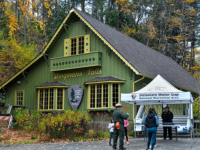 The charming Dingmans Falls visitor center, where the rustic green exterior hints at the natural wonders waiting just beyond those windows.