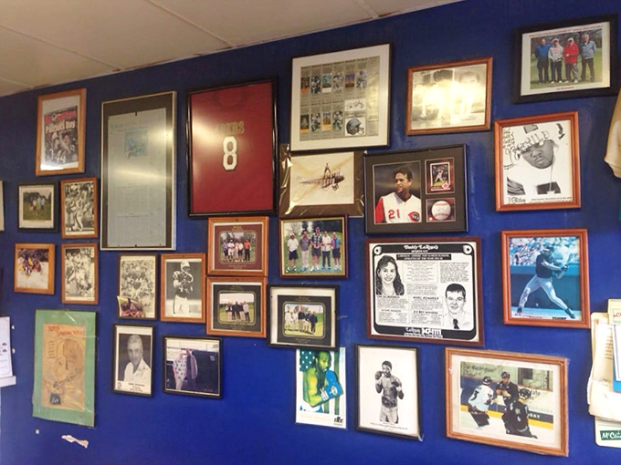 These walls aren't decorated – they're curated with decades of local sports heroes, community moments, and the kind of history that corporate chains spend millions trying to fake.