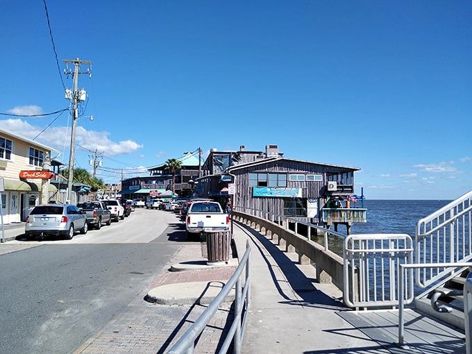 Cedar Key's rustic waterfront buildings perched over the Gulf. Old Florida fishing village frozen in time.