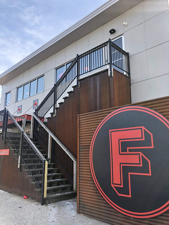 Futuro's industrial-chic design with metal siding and that distinctive red "F" signals this isn't your grandpa's pizzeria.