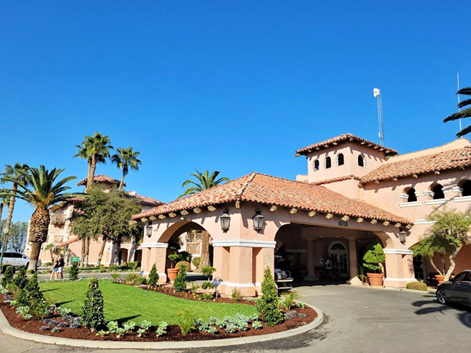 Palm trees frame this cattle country castle. Harris Ranch's impressive entrance promises an equally impressive dining experience inside.