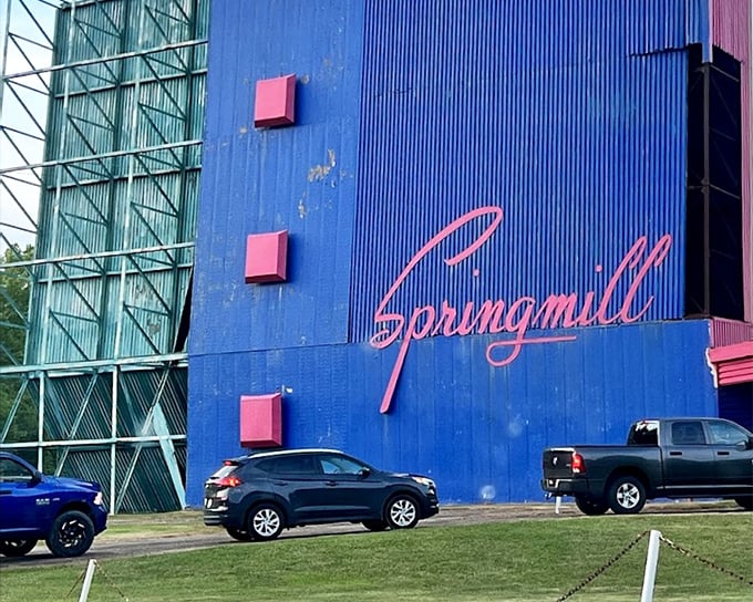 Springmill's vibrant blue facade with that classic script logo—architectural eye candy that promises entertainment before the movie even starts.