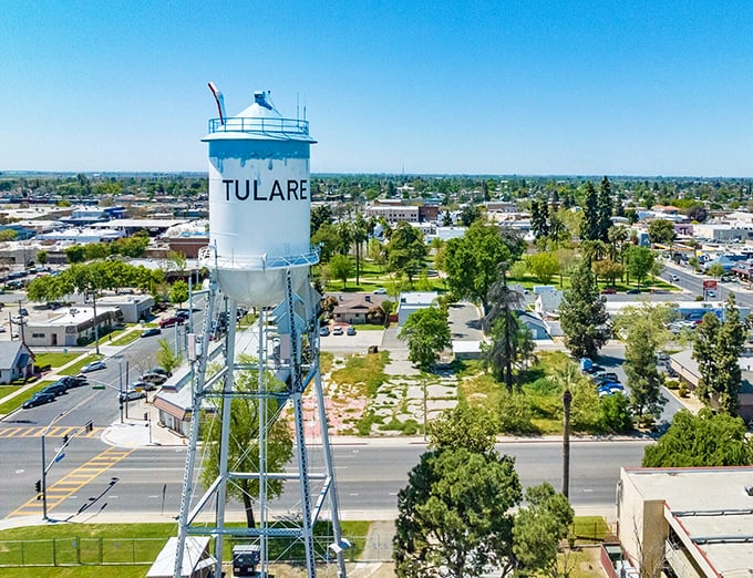 Tulare's distinctive water tower stands as a landmark in this agricultural community, where retirement savings grow as abundantly as the surrounding crops.