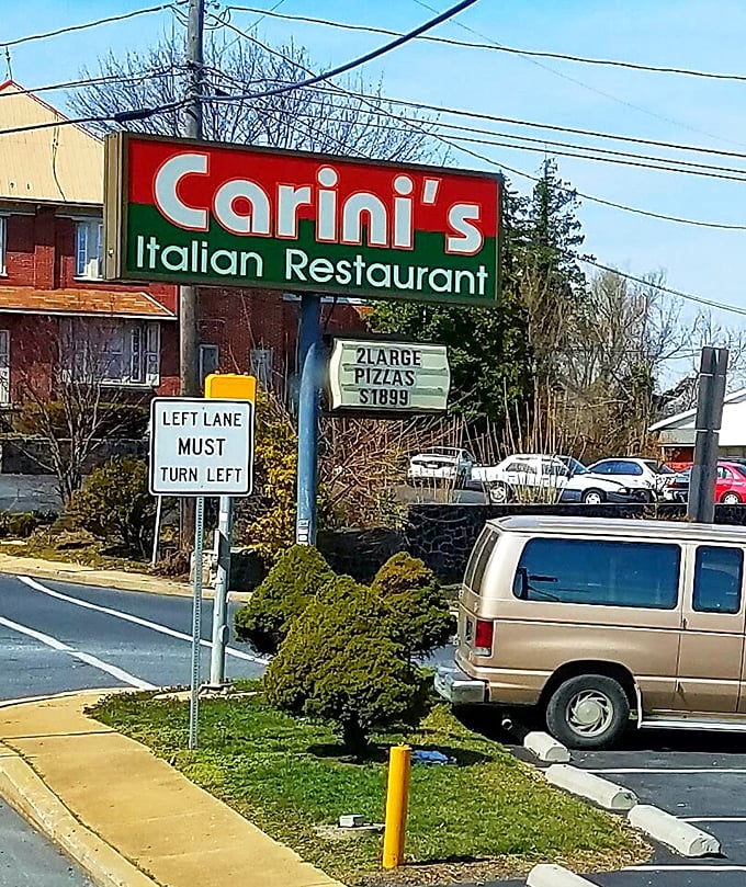 The iconic Carini's sign promises pizza deals that won't break the bank—where value isn't just a marketing term but a community commitment.
