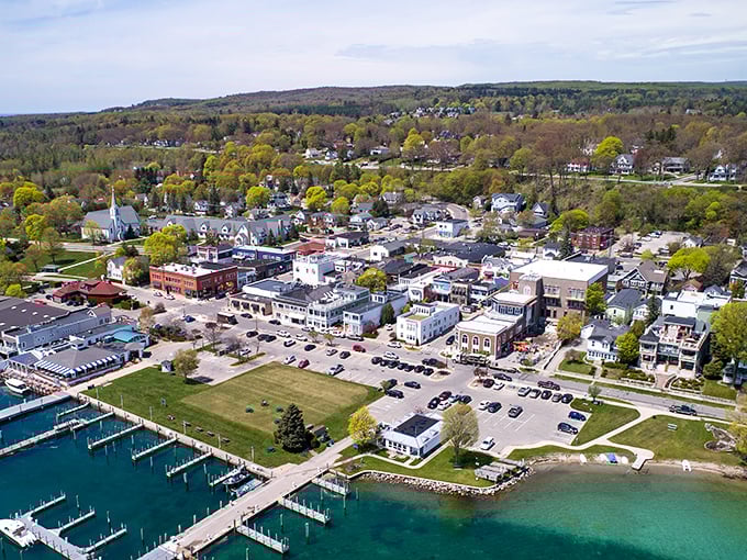 The aerial view of Harbor Springs reveals a town nestled perfectly between green hills and blue waters – Mother Nature's perfect composition.