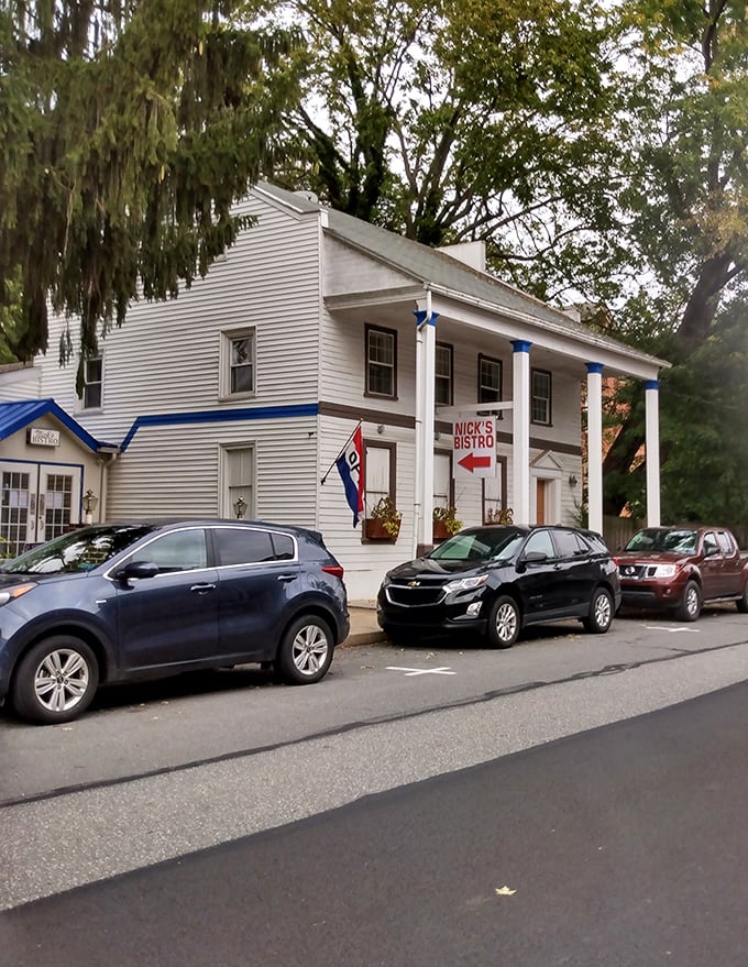 This classic white building with blue trim in Marietta houses local businesses where friendly faces know your name – and your budget.