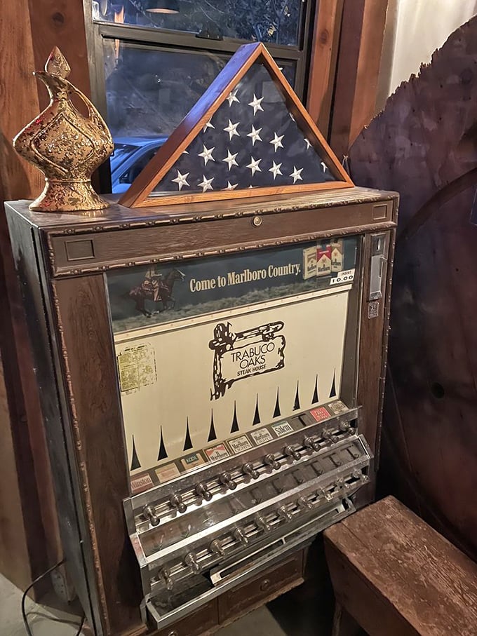 An antique cigarette machine stands as a nostalgic time capsule. Now dispensing memories instead of Marlboros.