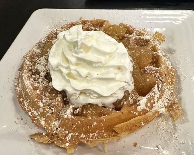 This apple-topped waffle with whipped cream isn't just breakfast—it's what happens when dessert wakes up early and crashes the morning party.