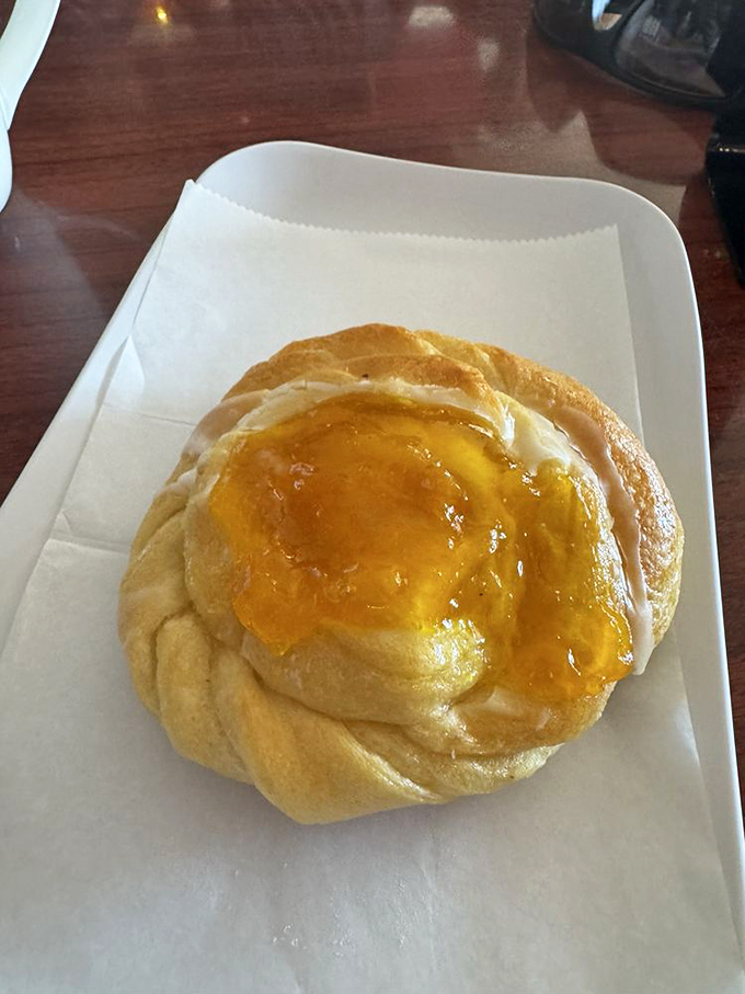 This apricot danish isn't just breakfast—it's edible sunshine. The glaze catches light like it's auditioning for a pastry calendar.