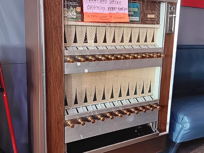 This vintage vending machine stands as a quirky sentinel of bygone days, dispensing memories alongside its wares.