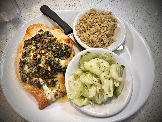 Perfectly cooked salmon with sides that don't feel like afterthoughts. The cucumber salad provides a crisp counterpoint that makes your taste buds do a happy dance.