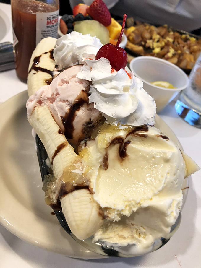 This banana split isn't just dessert, it's performance art – where every component from ice cream to whipped cream plays its role to perfection.