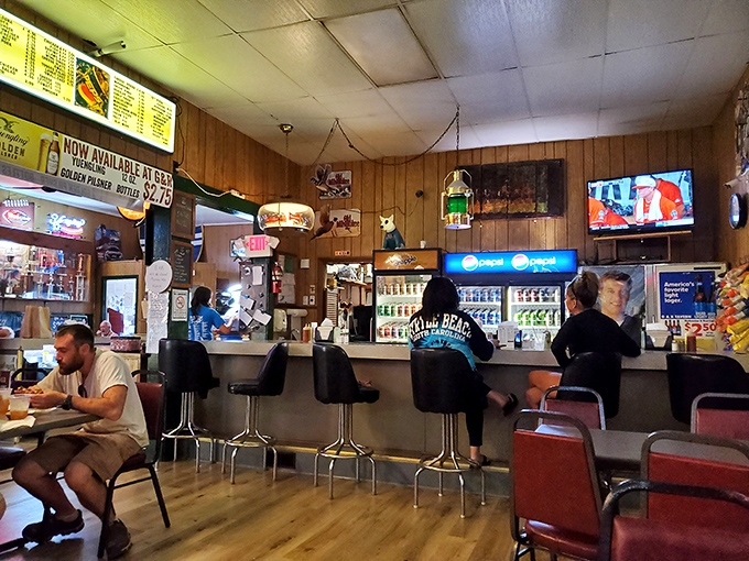 The bar area—where locals have been solving the world's problems over cold drinks and hot sandwiches for decades.